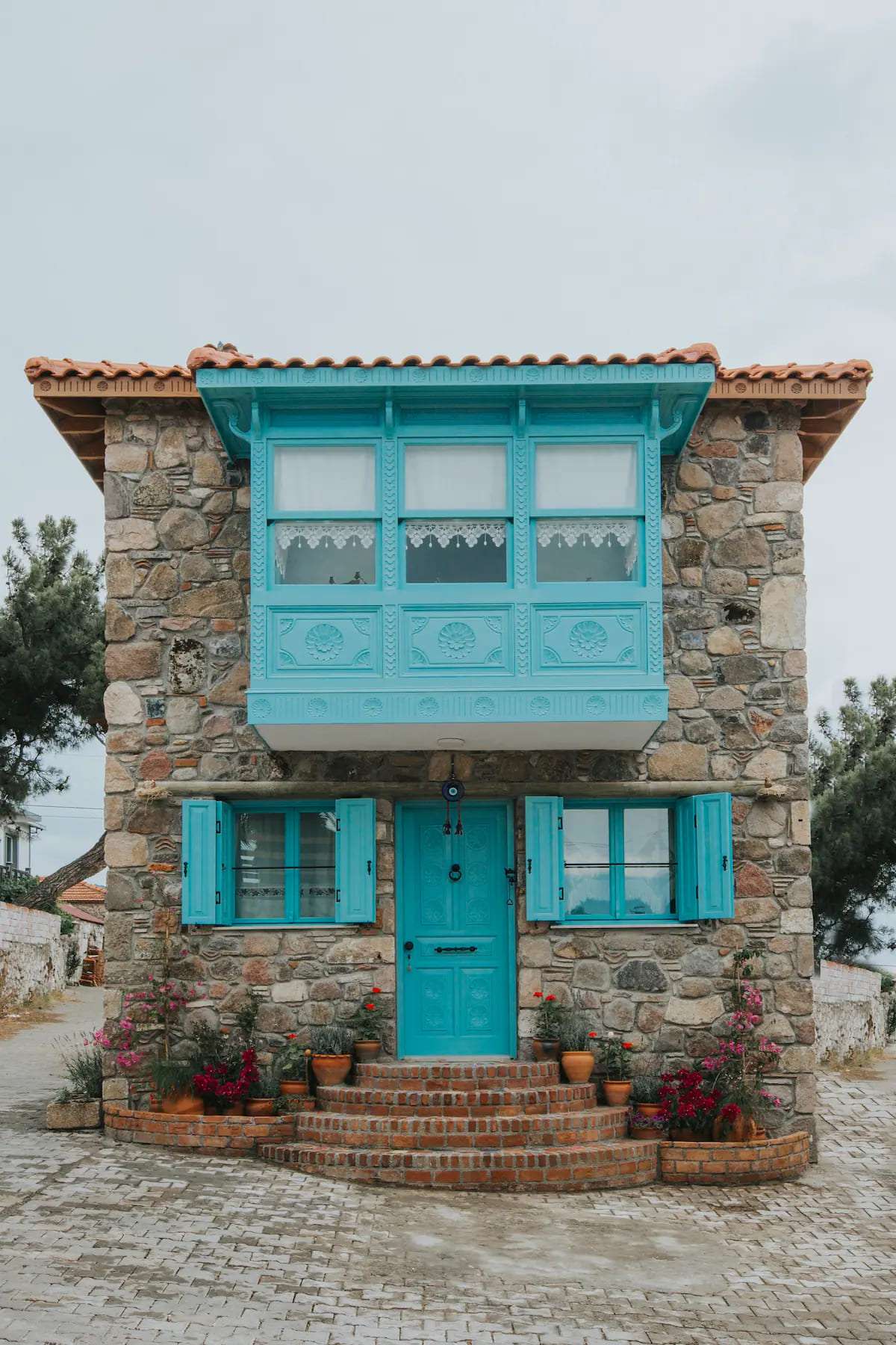 Stone Small House with Colorful Bay Window - Dream Tiny Living